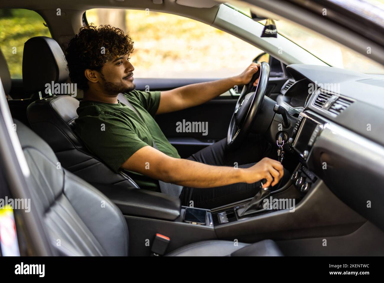 Young asian man driving car Stock Photo - Alamy