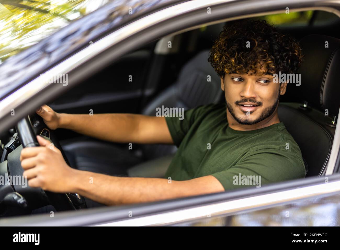 Portrait of an handsome asian business man driving his car Stock Photo ...