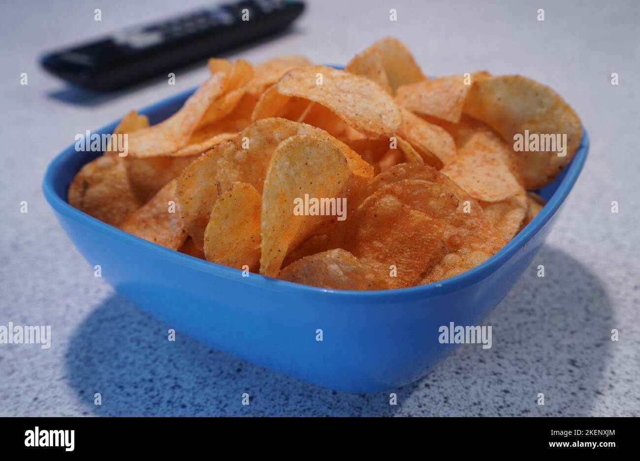 Bowl of BBQ flavoured chips Stock Photo - Alamy