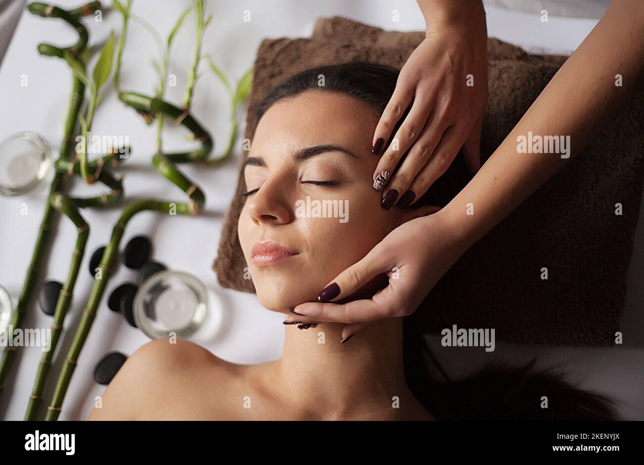 beautiful girl in a beauty salon with orchid flower in her hair. spa ...