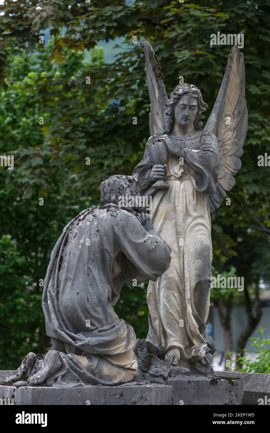Sculptures on an old tomb, cemetery of Riezlern in Kleinwalsertal ...