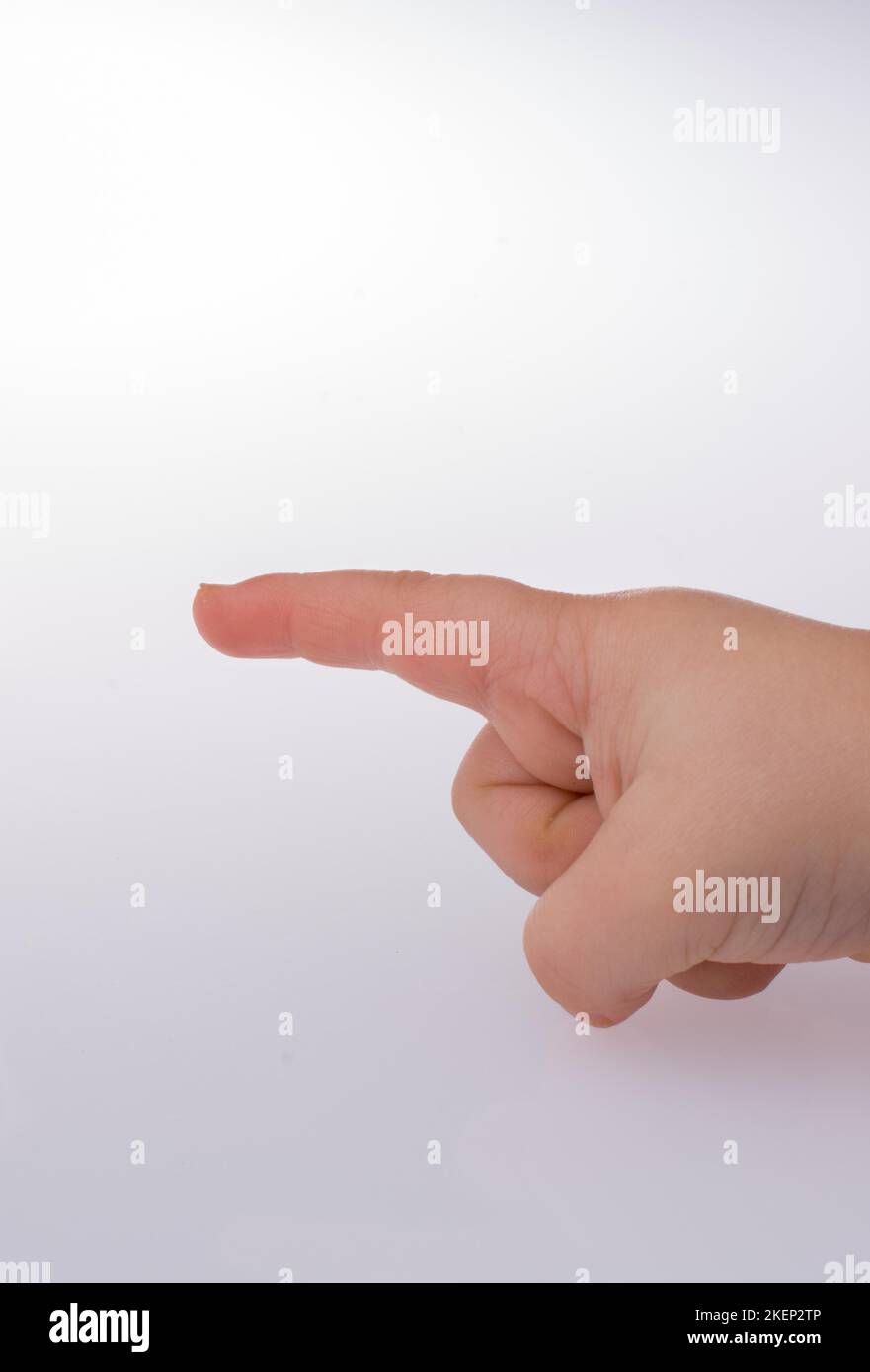 Little hand pointing at a model house on a white color background Stock ...