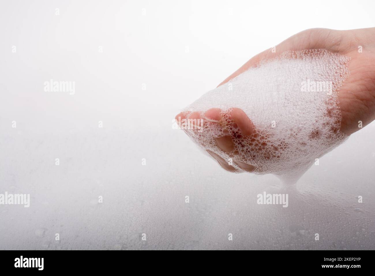 Hand washing and soap foam on a foamy background Stock Photo - Alamy