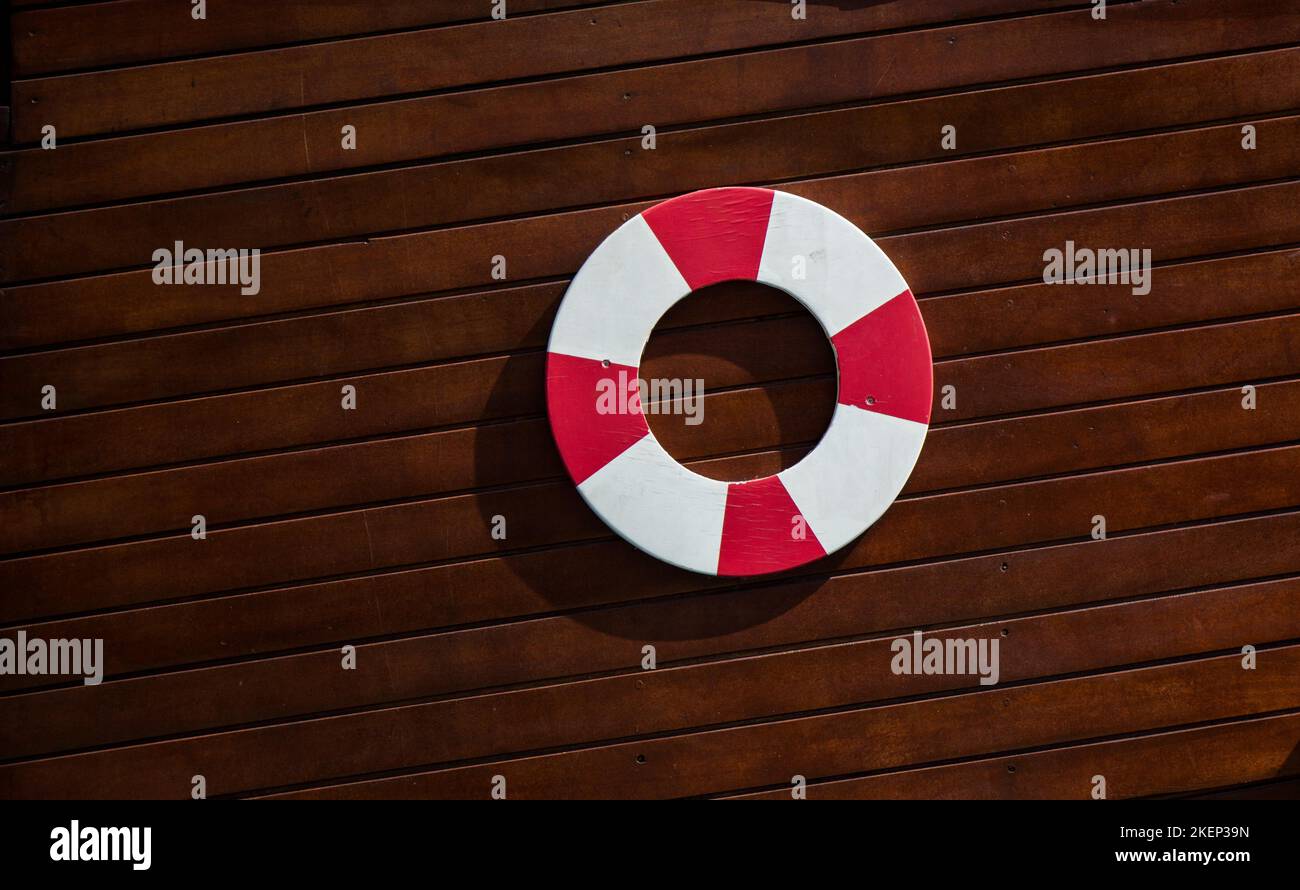 Life preserver or life saver hanging in air Stock Photo - Alamy