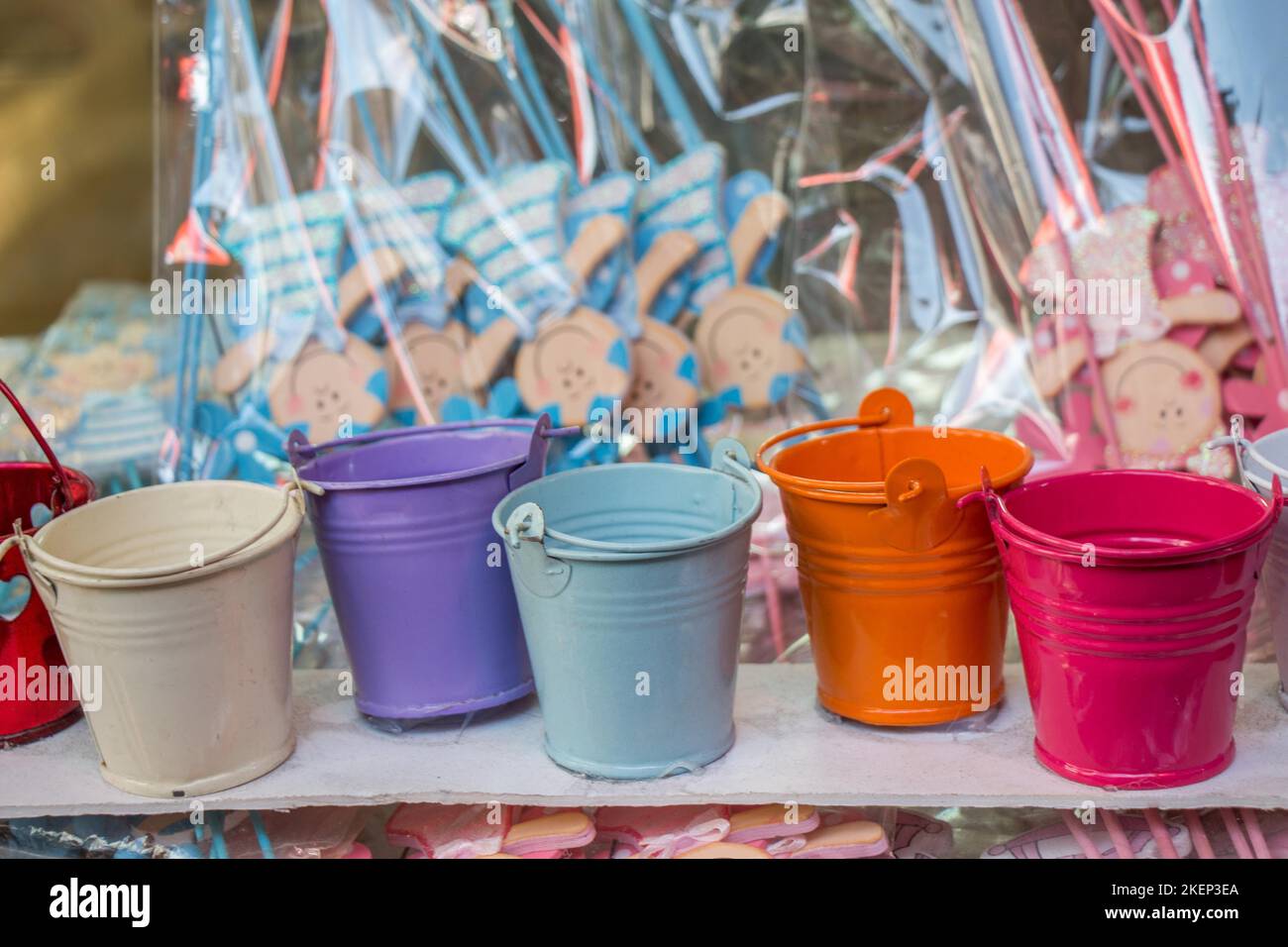 Little set of buckets of various colors in a market place Stock Photo ...