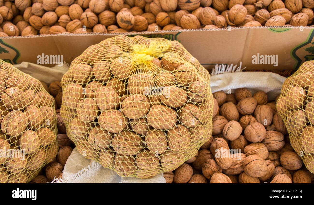 Sack of whole fresh walnuts with hard nutshells Stock Photo - Alamy