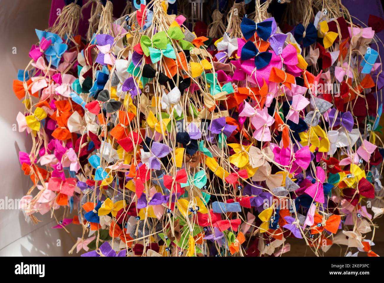 Collection of colored bows and ribbons on threads Stock Photo - Alamy