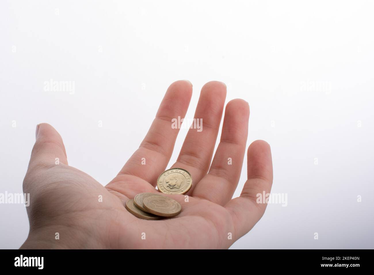 Hand handing money on a white bakground Stock Photo - Alamy