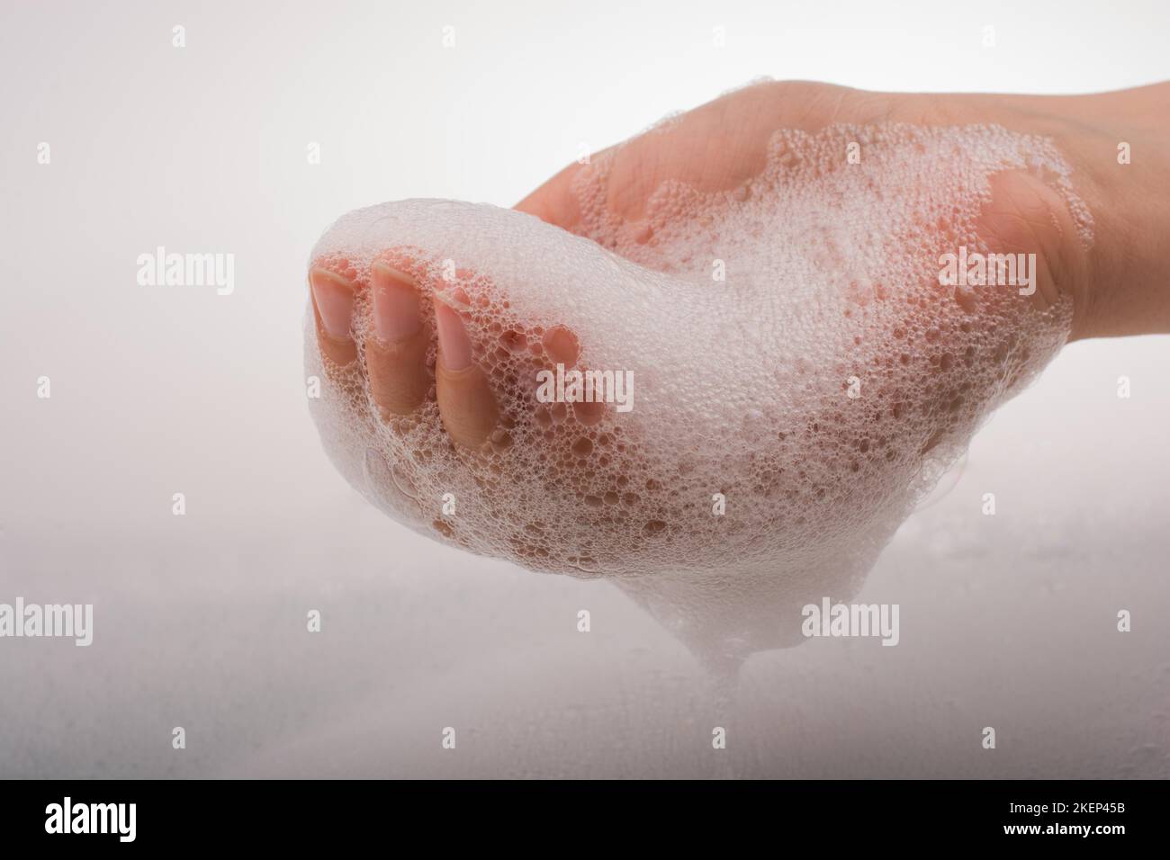 Hand washing and soap foam on a foamy background Stock Photo - Alamy