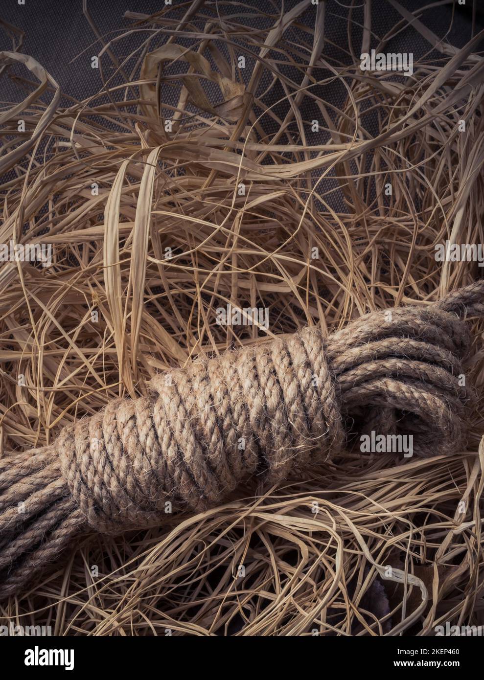 Bundle of linen rope in a straw background Stock Photo - Alamy