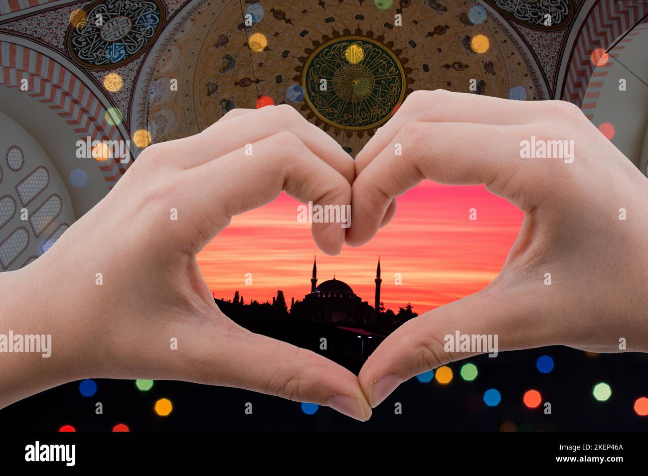 Islamic mosque view seen behind a heart shaped hand Stock Photo - Alamy
