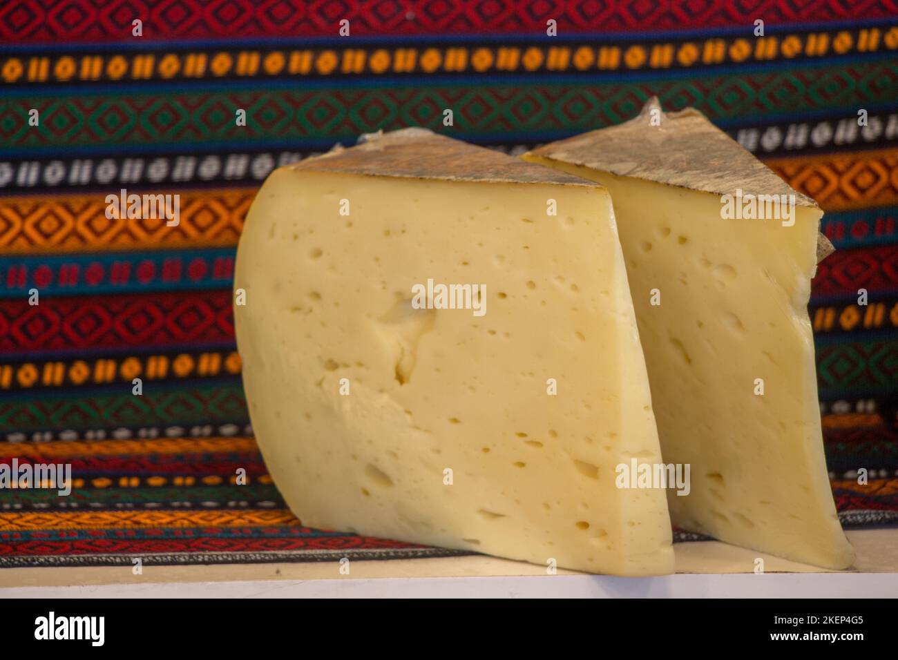 Cuts of kashkaval or kasseri cheese for sale on the shelf Stock Photo ...