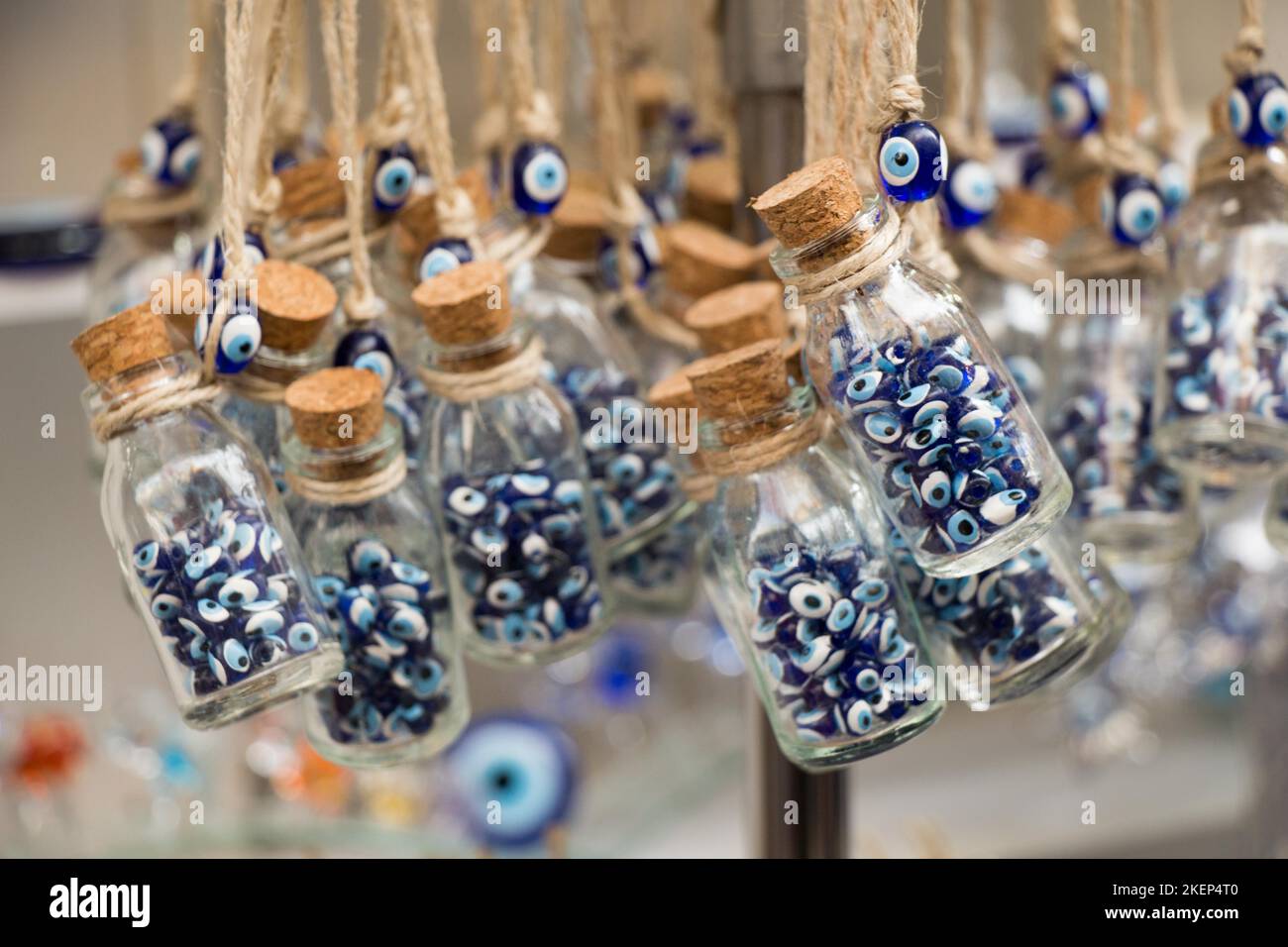Little transparent glass bottle filled with blue evil eye beads Stock ...