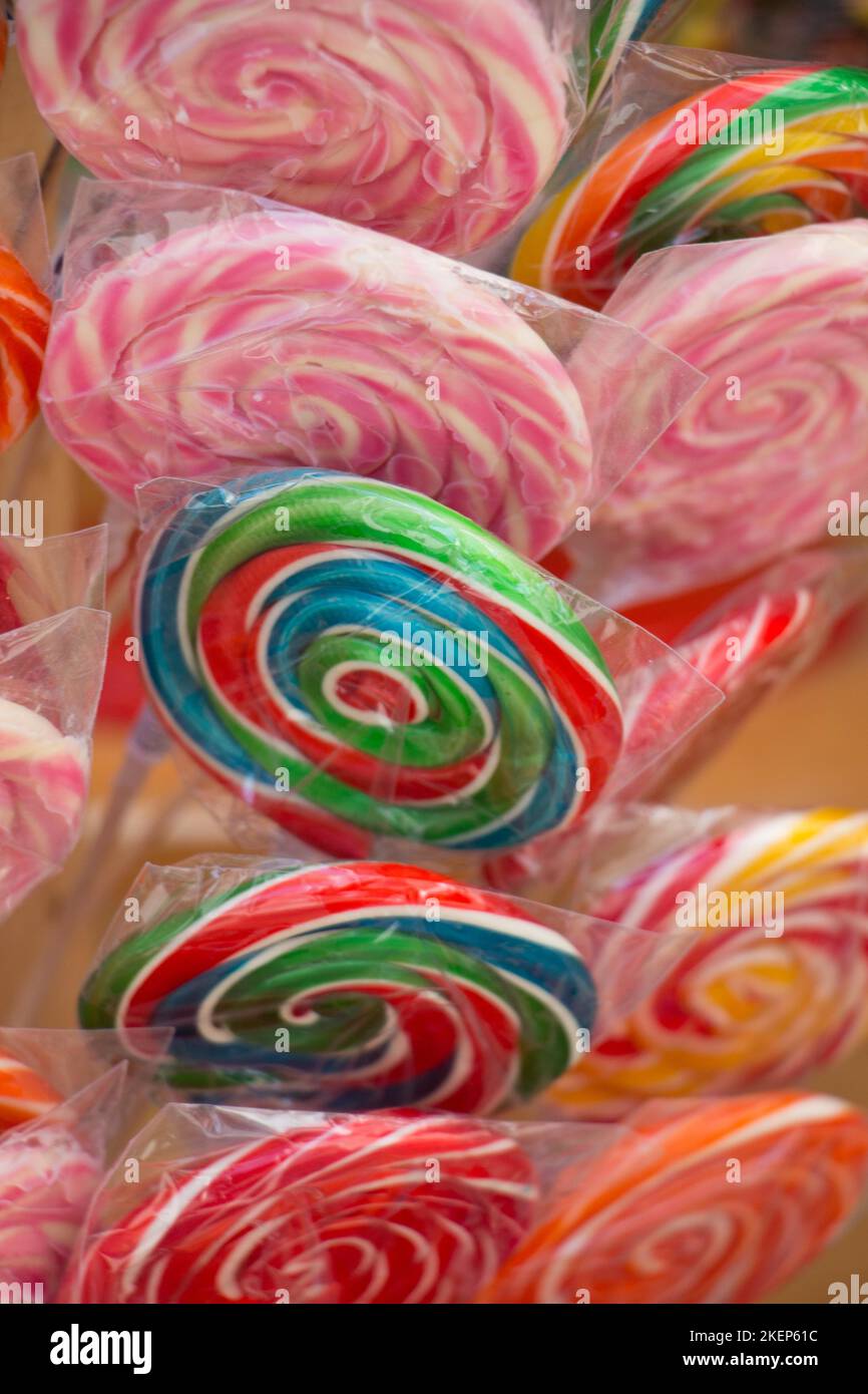 Delicious colorful swirl candy and sweets for kids Stock Photo - Alamy
