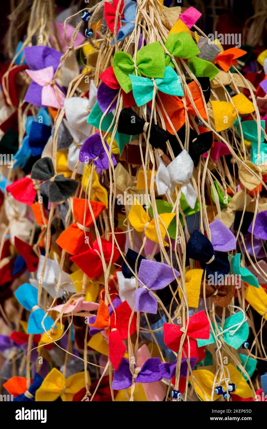 Collection of colored bows and ribbons on threads Stock Photo - Alamy