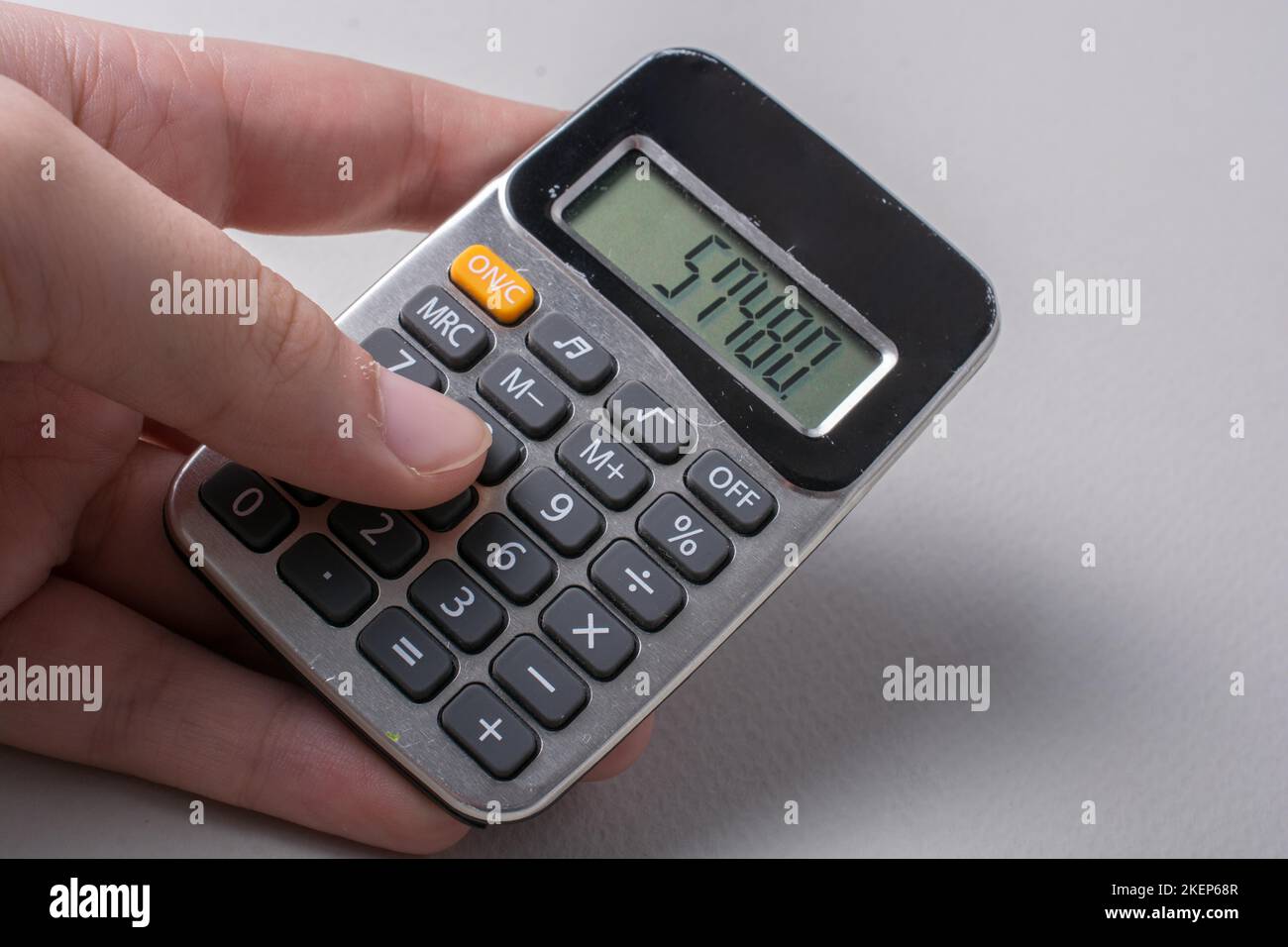 Hold calculator hi-res stock photography and images - Alamy