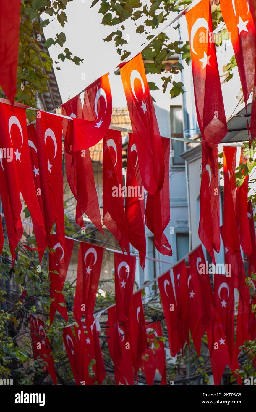 Turkish national flag hang on a pole on a rope in the street in open ...