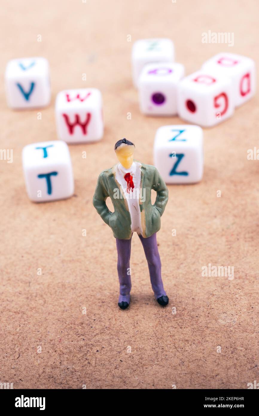 Figurine standing in front of the colorful alphabet letter cubes Stock ...