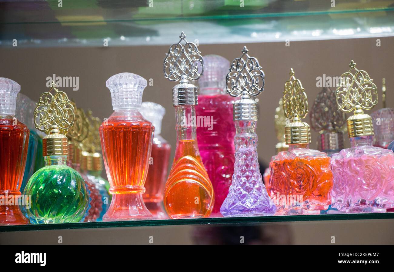 Set of small colorful transparent bottles Stock Photo - Alamy