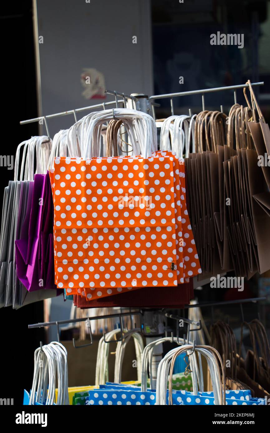 One simple color paper shopping bag in the market place Stock Photo - Alamy
