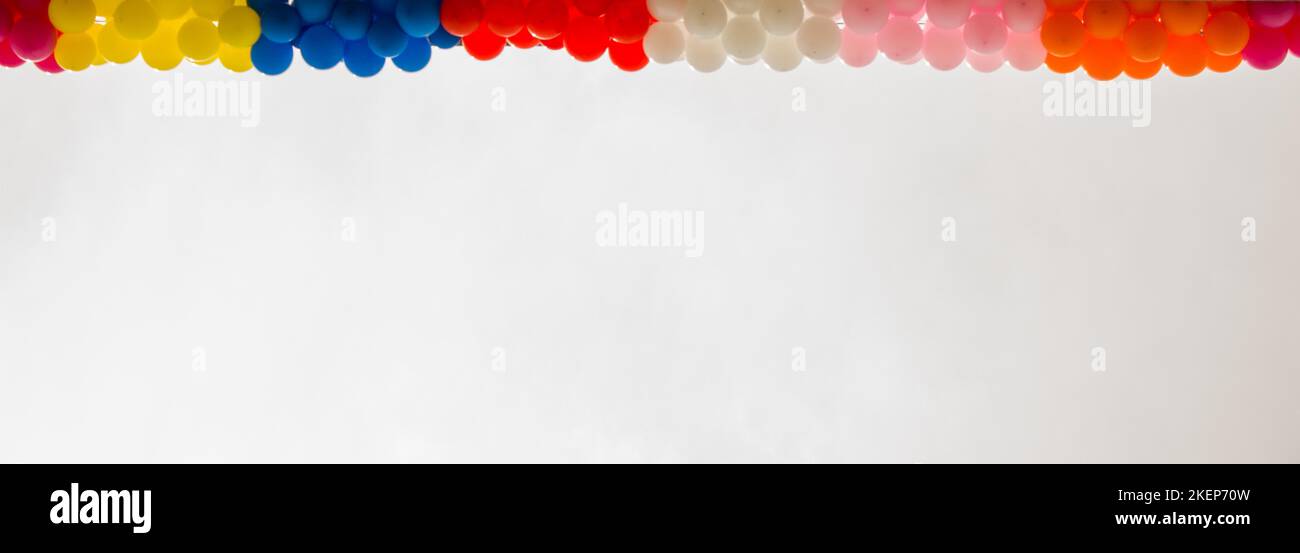 Color balloons on the roof of a building Stock Photo - Alamy