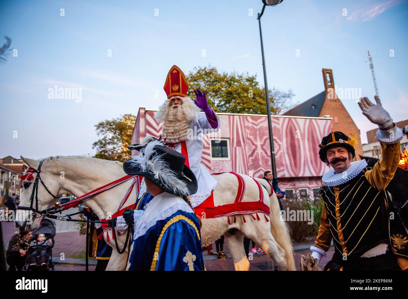 St Nicholas is seen cheering the children and the families waiting for ...