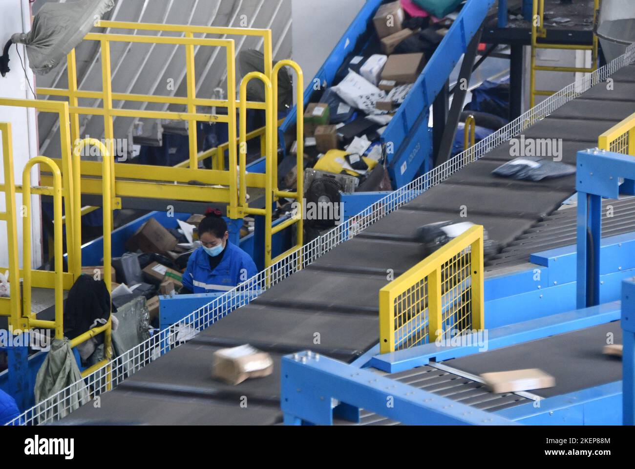 Workers are sorting express parcels at ZTO Express Transfer Center in ...