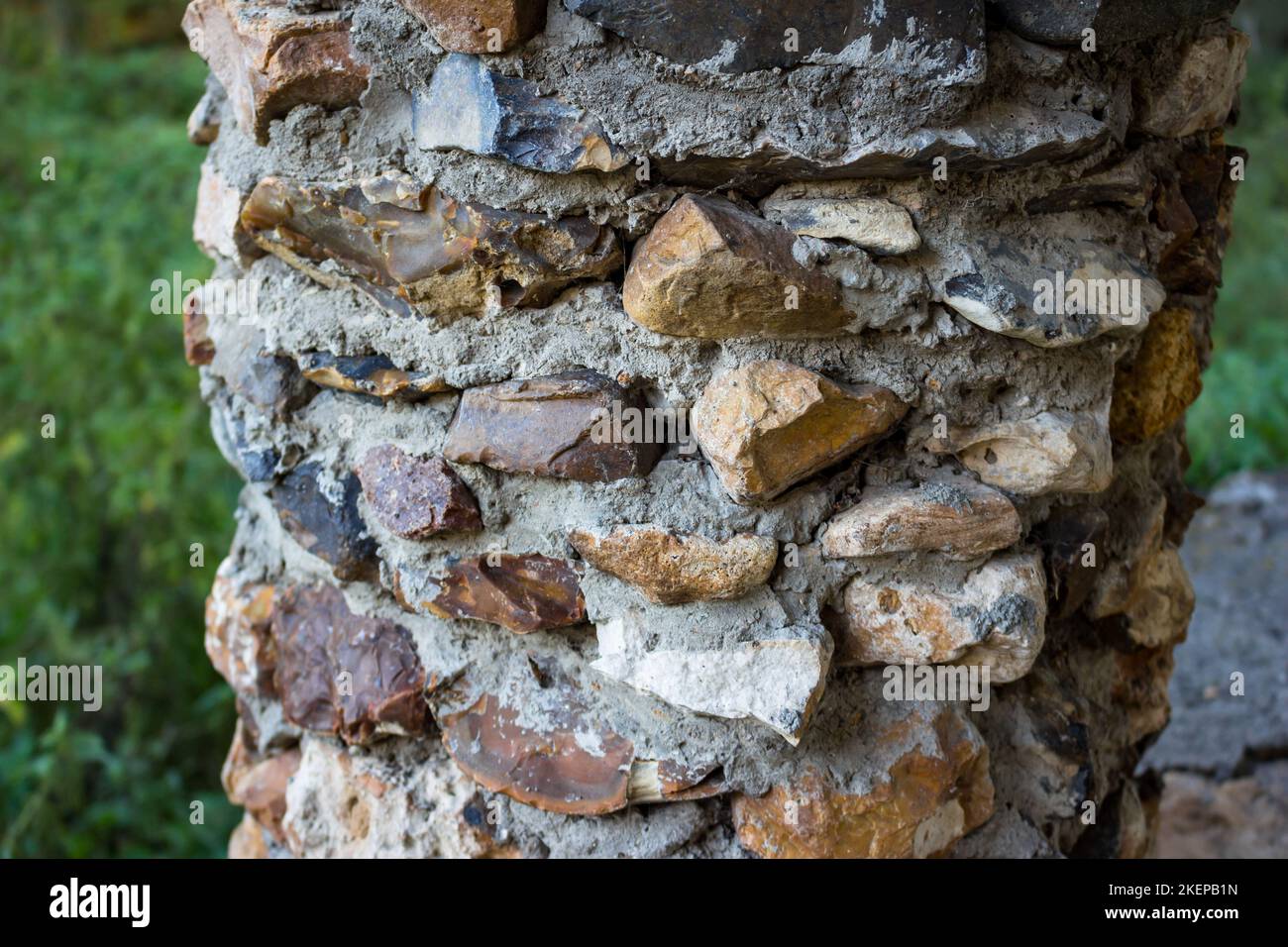 Fragment of a column made of river flint pebbles Stock Photo - Alamy