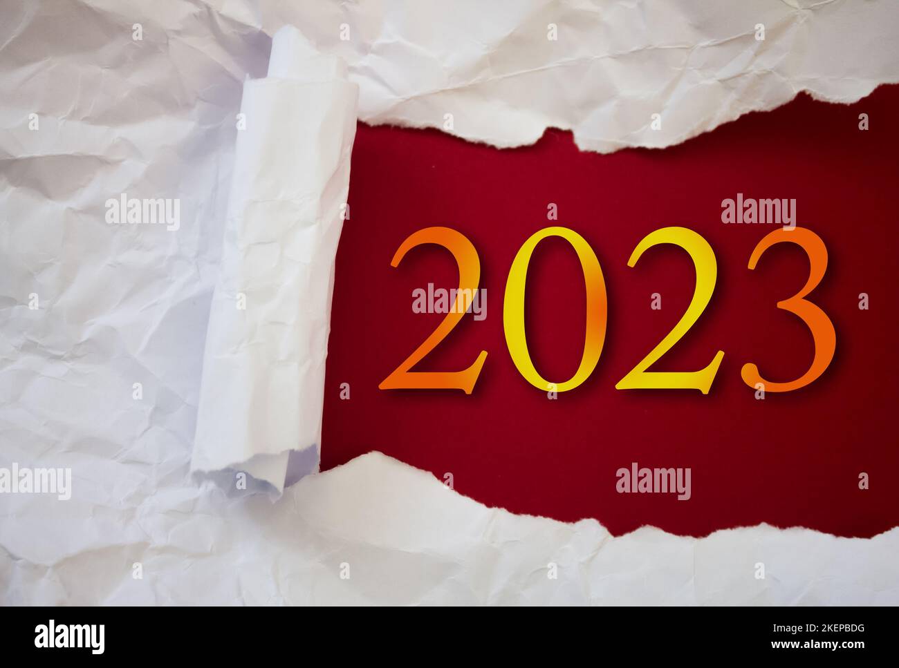 The number 2023 with Torn, Crumpled White Paper on colored background ...