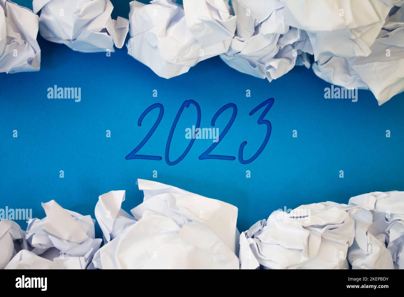 The number 2023 with Torn, Crumpled White Paper on colored background ...