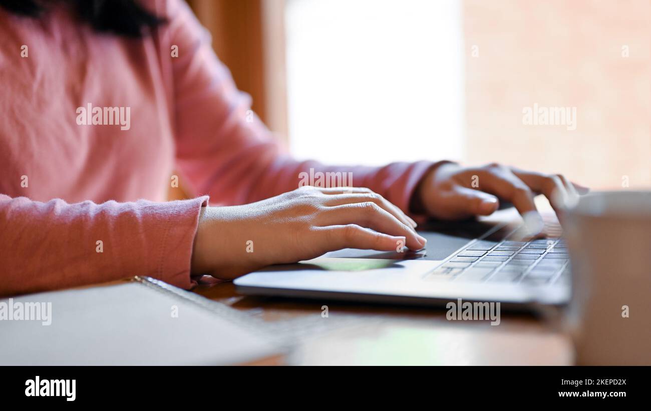 close-up image, Female freelancer or college student typing on laptop ...