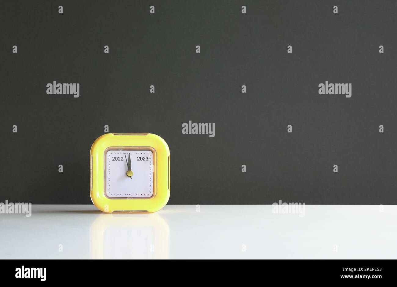 Yellow clock showing 2022 and 2023. Countdown to new year concept. Copy ...