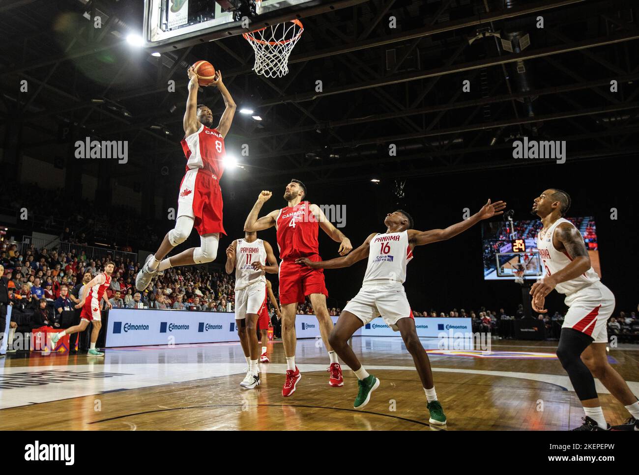 Canada's Jean-Victor Mukama (8) dunks the ball as Owen Klassen (4) and ...