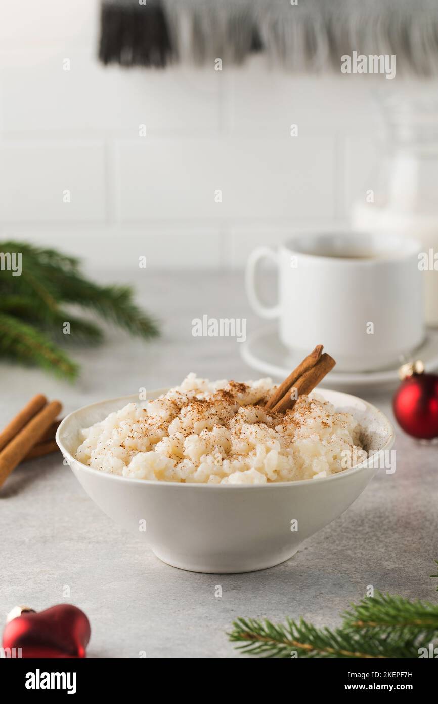 Scandinavian rice porridge with cinnamon in a bowl surrounded by ...