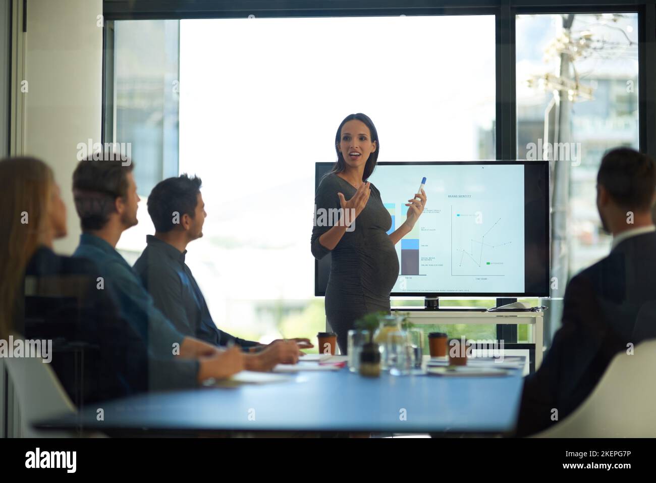 Taking stock and setting new targets. a corporate businessperson giving ...