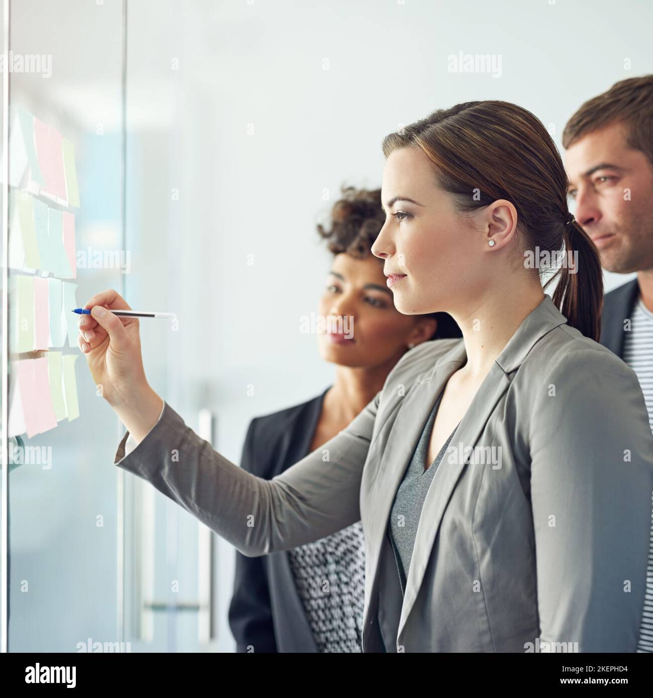 In search of some fresh ideas. a group of colleagues having a ...