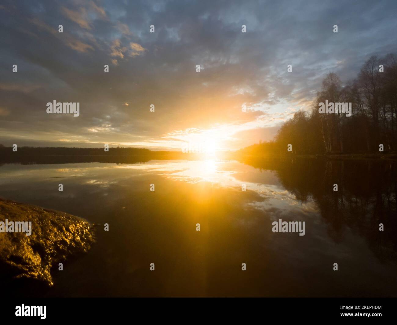 Water surface. View of a Sunset sky background. Dramatic gold sunset ...