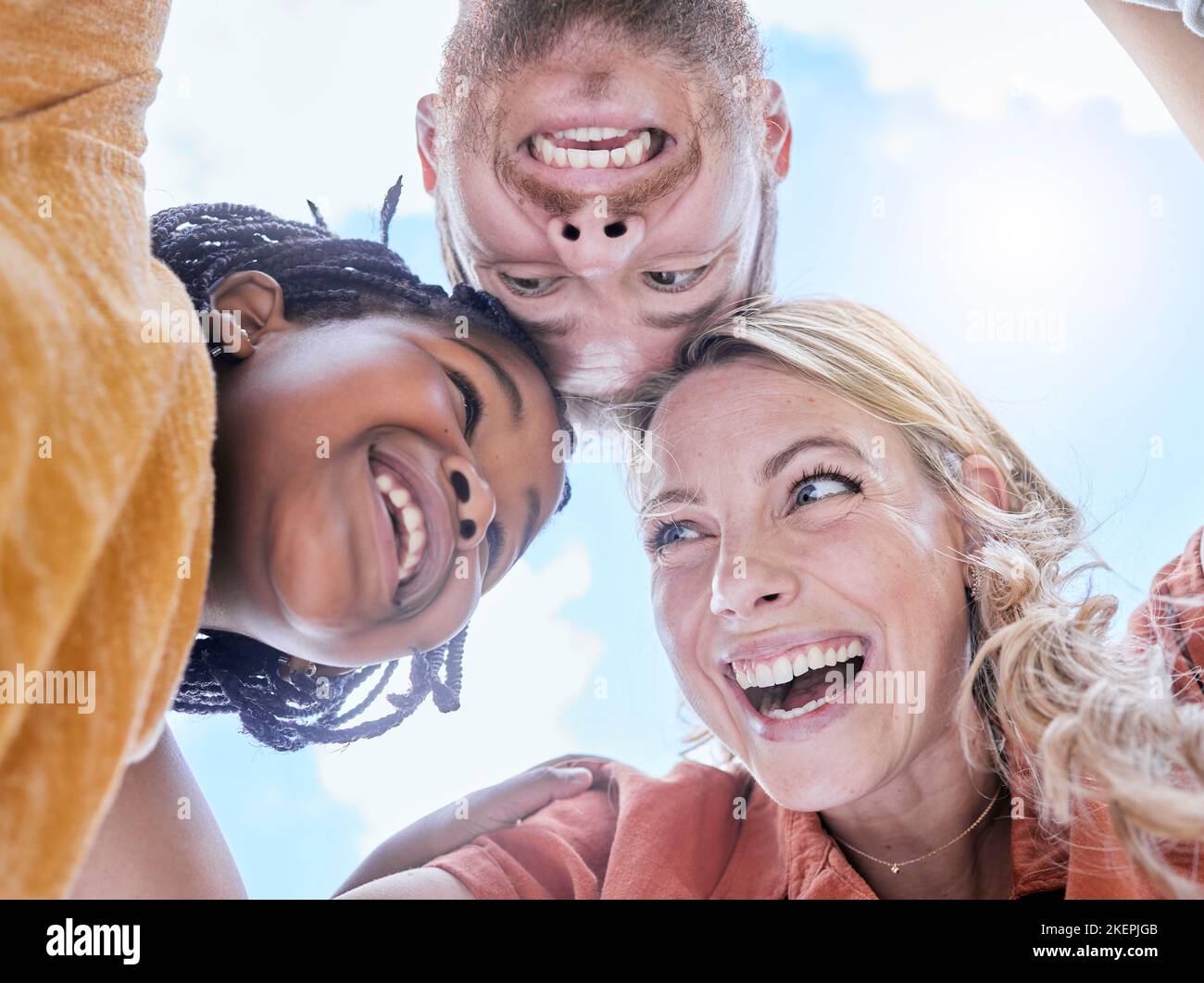 Happy, smile and interracial family hug of mother, father and girl ...