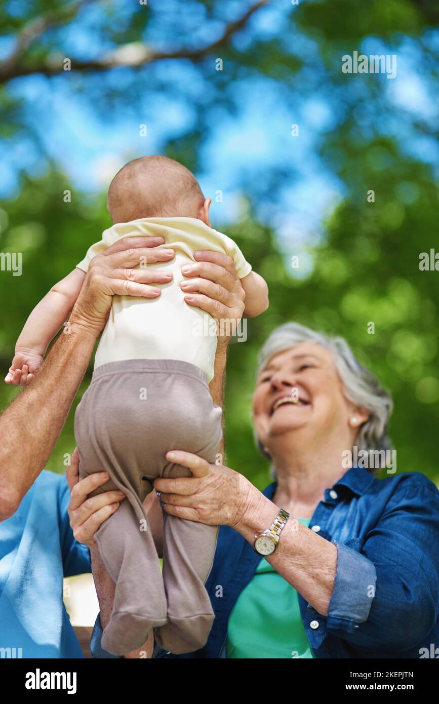 I love my grandson with all my heart. a senior couple spending time ...