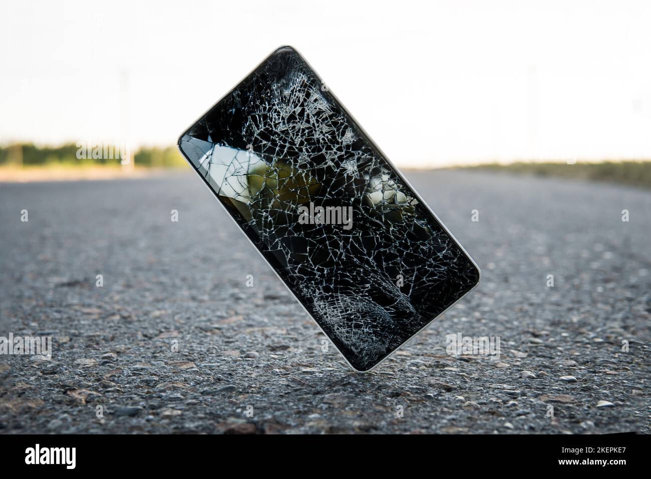 Crash test. Mobile phone falling and crashes on asphalt, broken ...