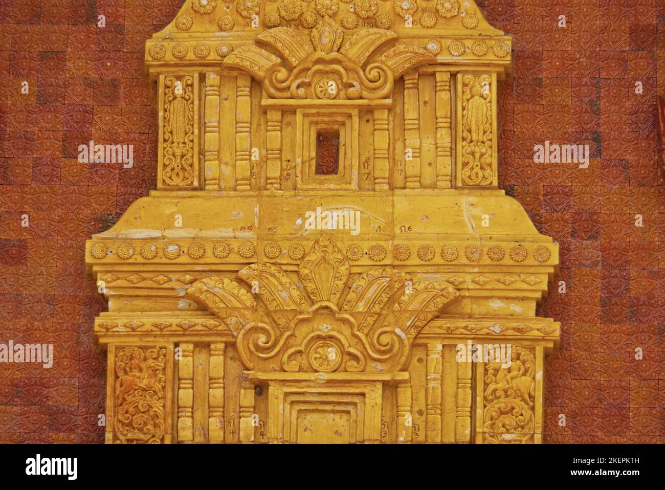 Temple architecture detail showing intricate carving and brown and gold ...