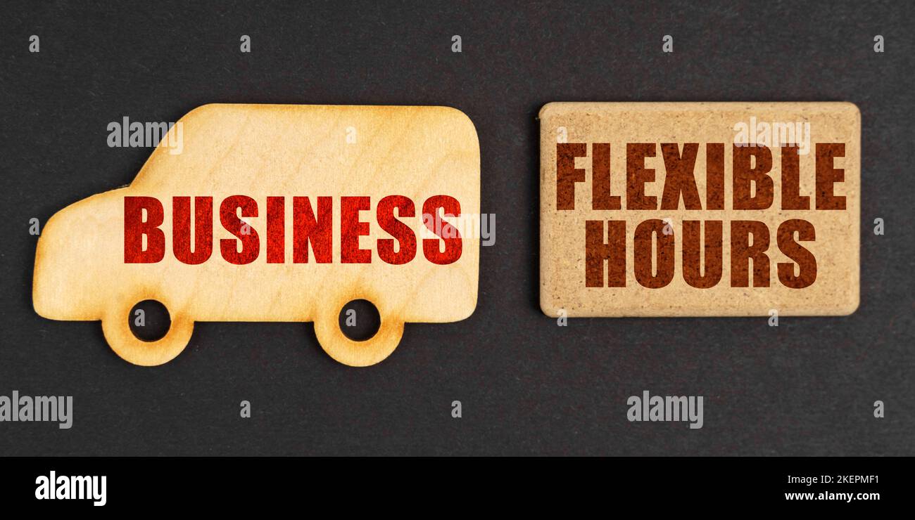 Business concept. On a black background, a car - business and a sign ...