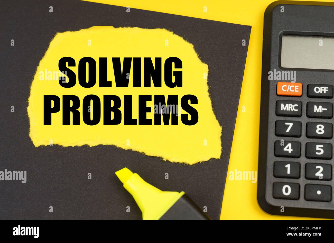 Business concept. On a yellow background, a calculator, a black sheet ...