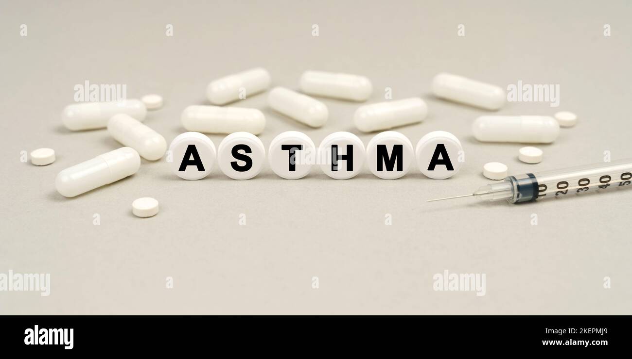 Medicine concept. On the table are capsules, a syringe and pills that ...