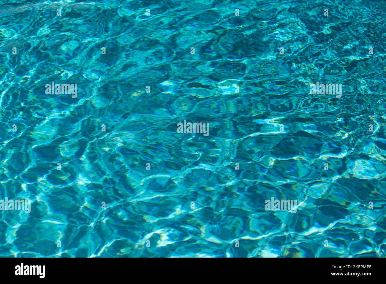 Background of blue water in swimming pool with sun reflection, ripple ...