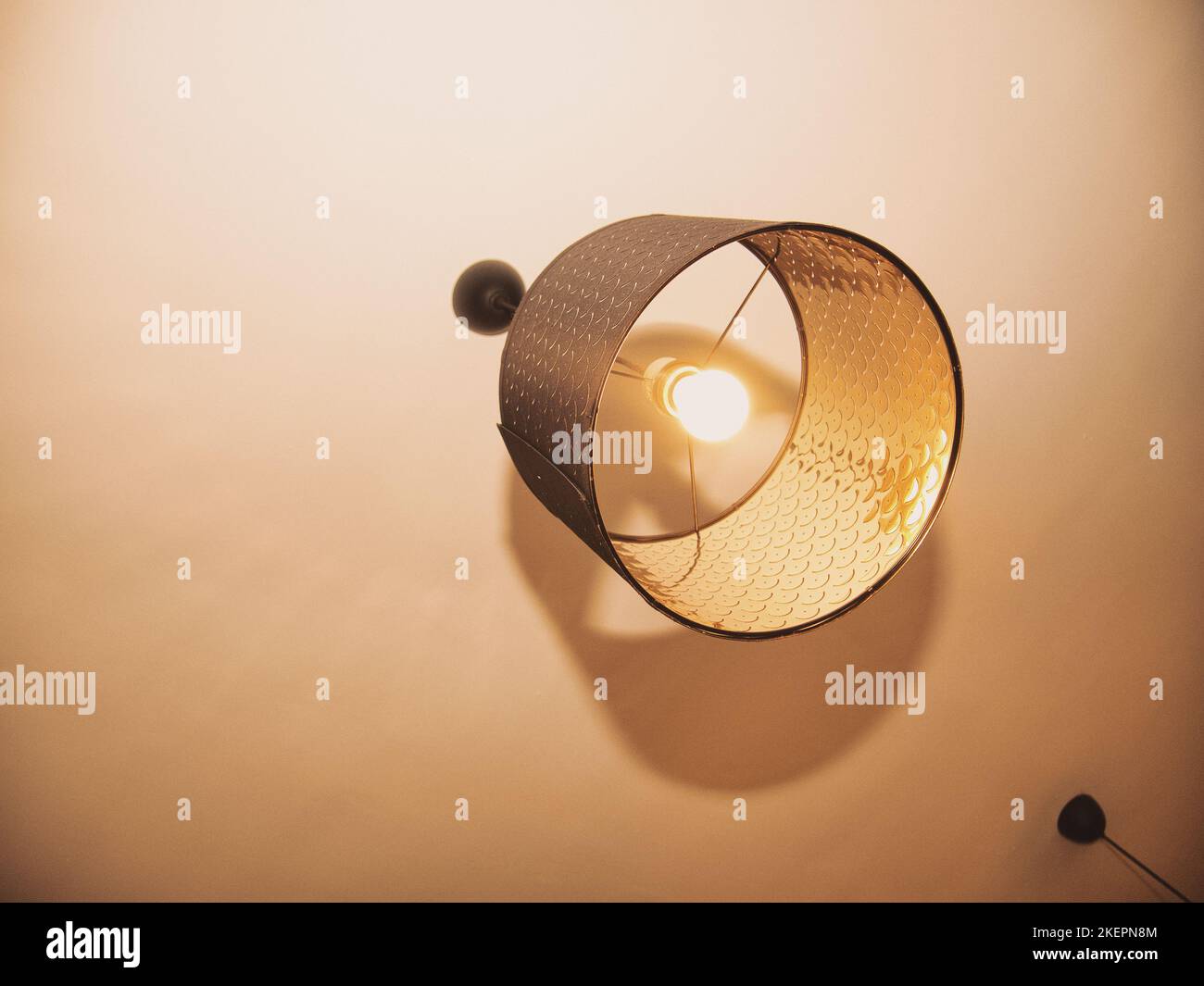Lamp on the ceiling casting a nice shadow Stock Photo - Alamy