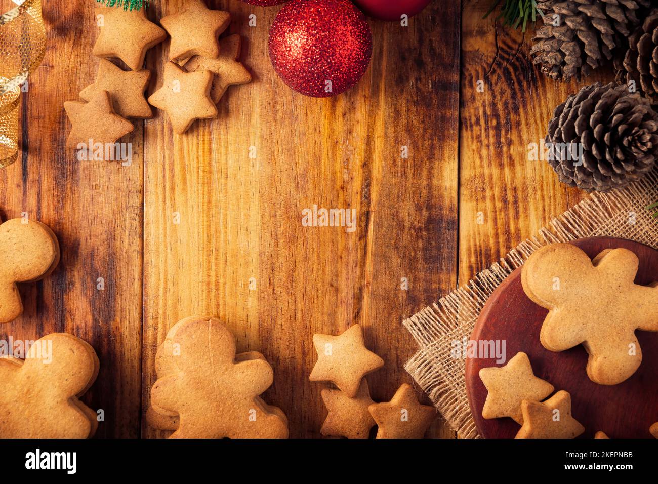Homemade gingerbread men cookies and christmas decoration on rustic ...