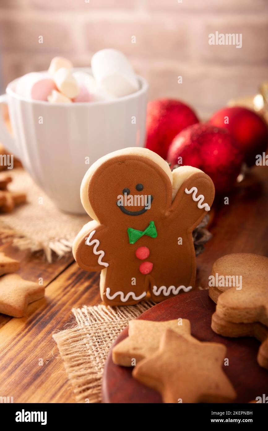 Christmas Homemade gingerbread man cookie and white cup with hot ...