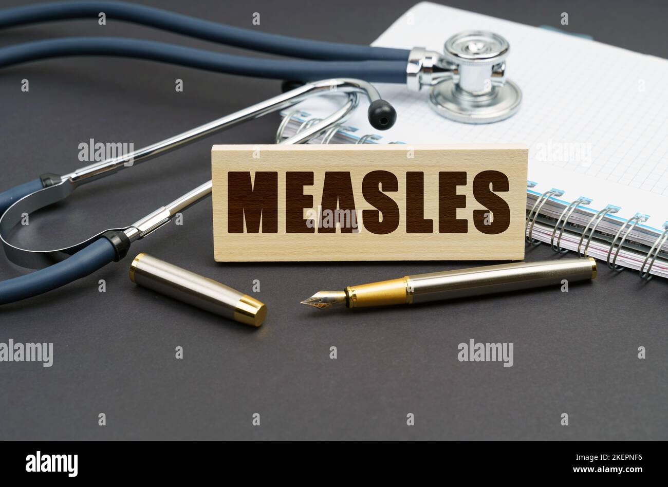 Medicine concept. On the table is a notebook, a stethoscope and a sign ...