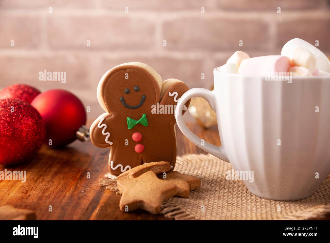 Christmas Homemade gingerbread man cookie and white cup with hot ...
